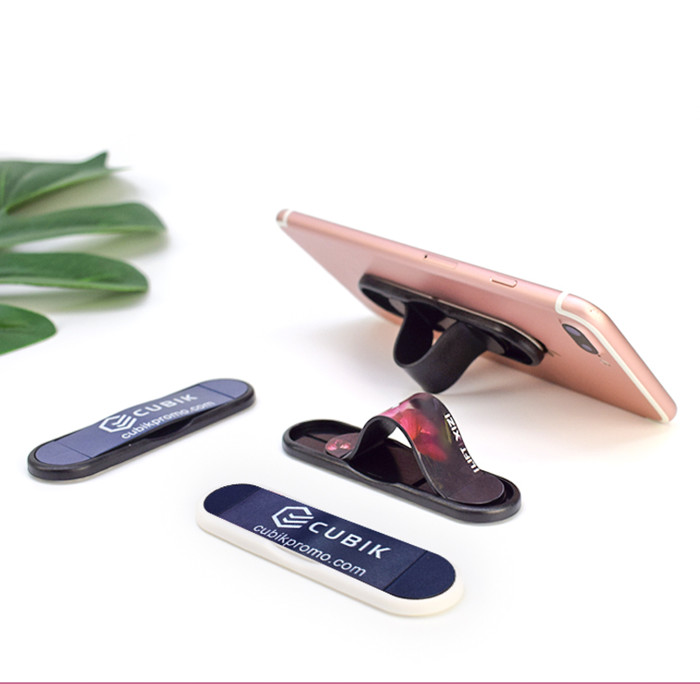 A 3" long, 1" wide, adhesive-backed plastic thing. There is no text on ...