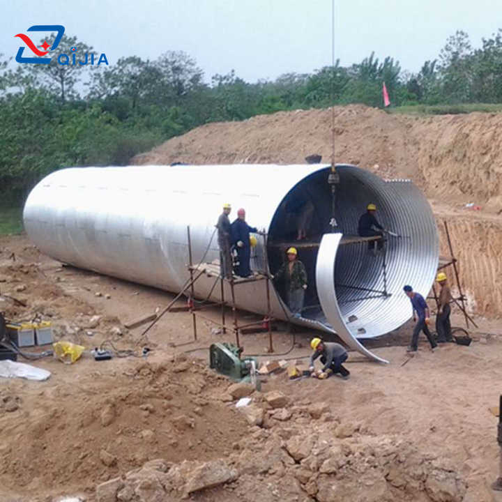 Buried under-ground road culvert assembly corrugated galvanized steel ...