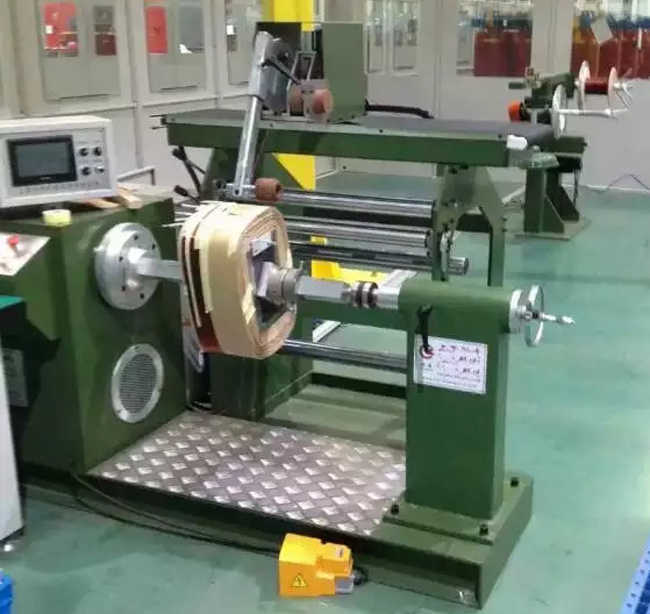 HV coil winding machine with conductor traversing device for ...