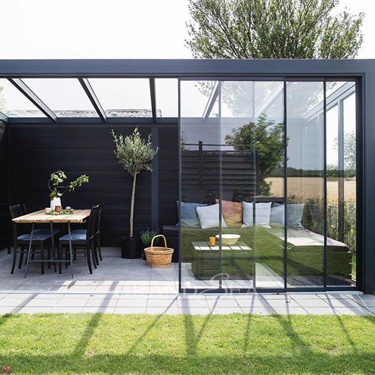 Minimalist Black Frame Glass Sunroom Villa with Industrial-grade ...