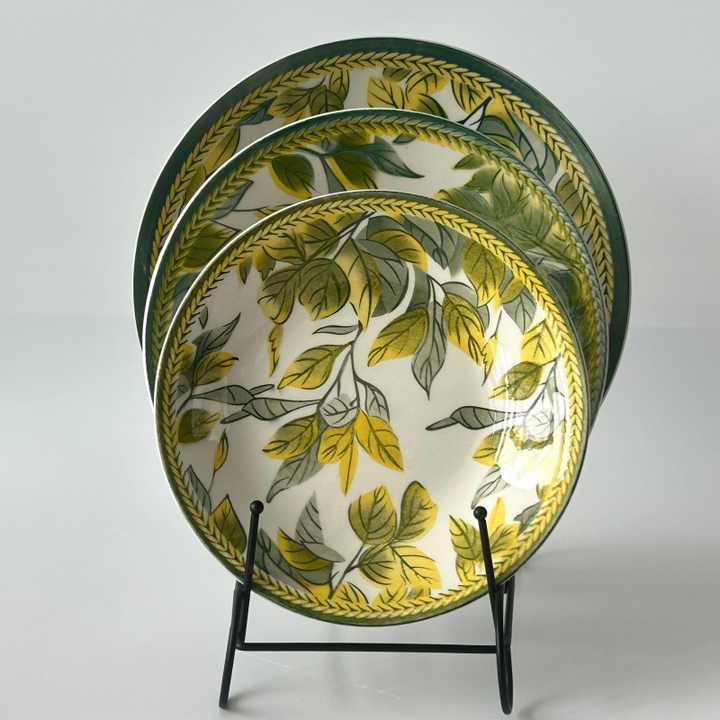 Vibrant Ceramic Dinnerware Set with Leaf Design and Warm Color Palette ...